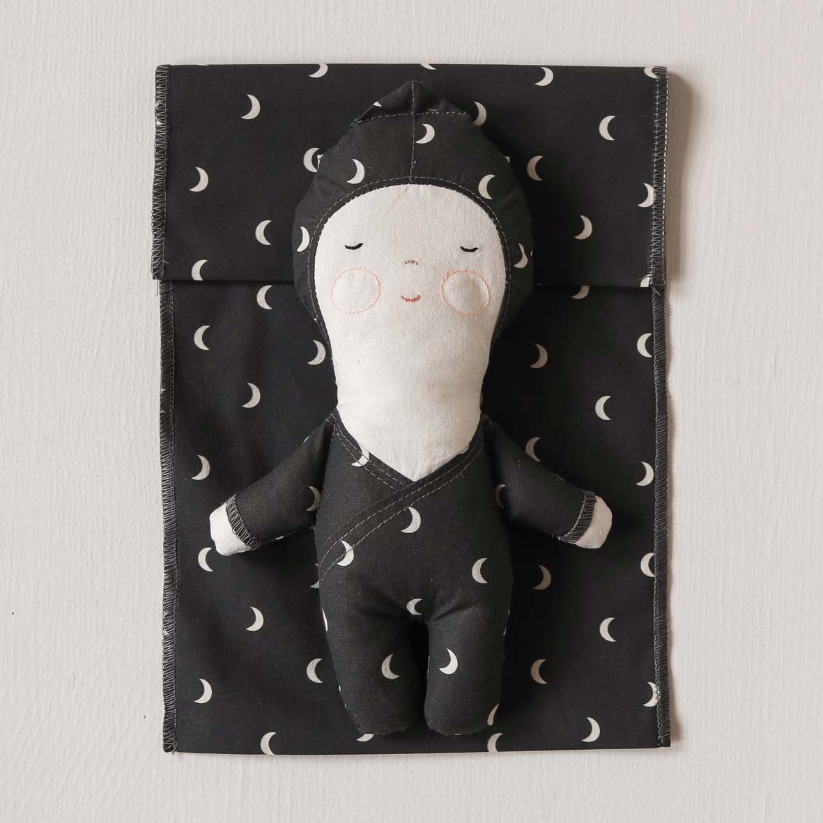 Zoonie doll, midnight pattern sleeping into his bed